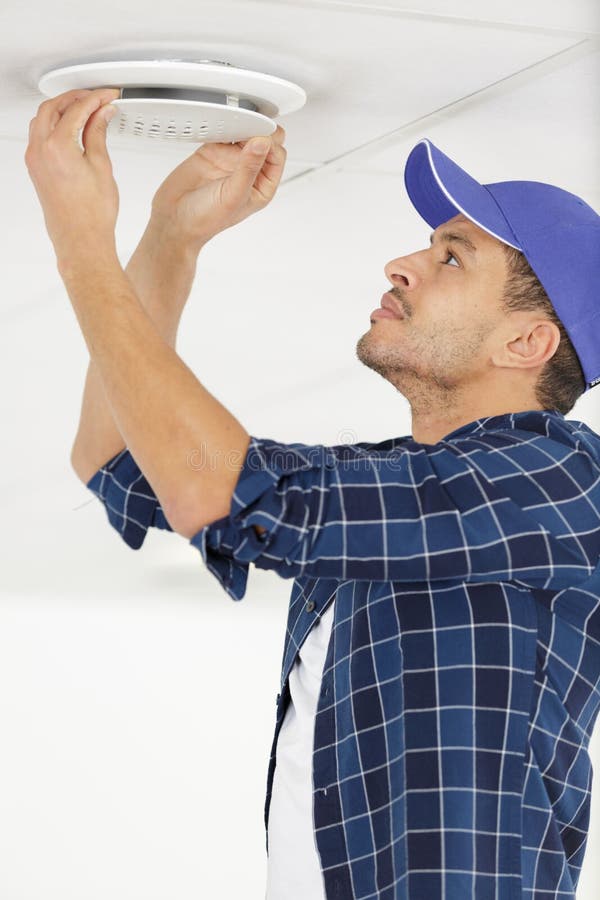 Man Fixes Device To Ceiling Stock Image - Image of close, cable: 265996171