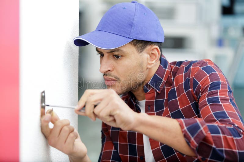 Man Fixes Electrical Switch on Wall Stock Image - Image of adult, hands ...