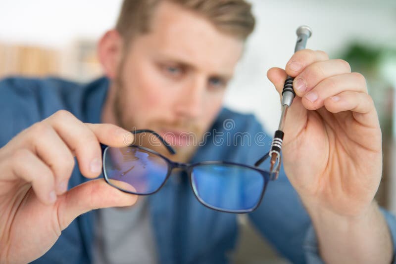 Man Fixes Glasses in Laboratory Stock Image - Image of office, fixing ...