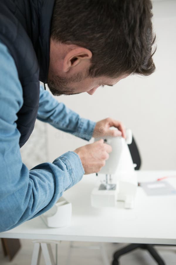 Man fixes machine stock photo. Image of safety, horizontal - 242459276