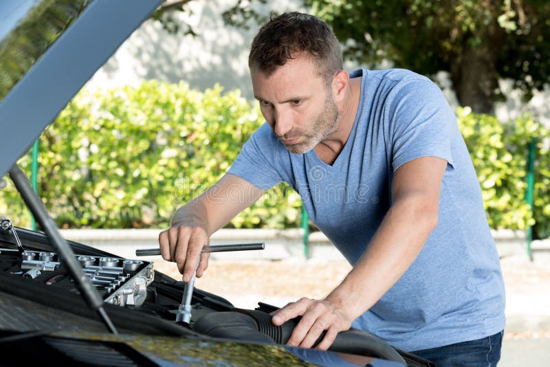 Man fixes super car engine stock photo. Image of carmaintenance - 266720826