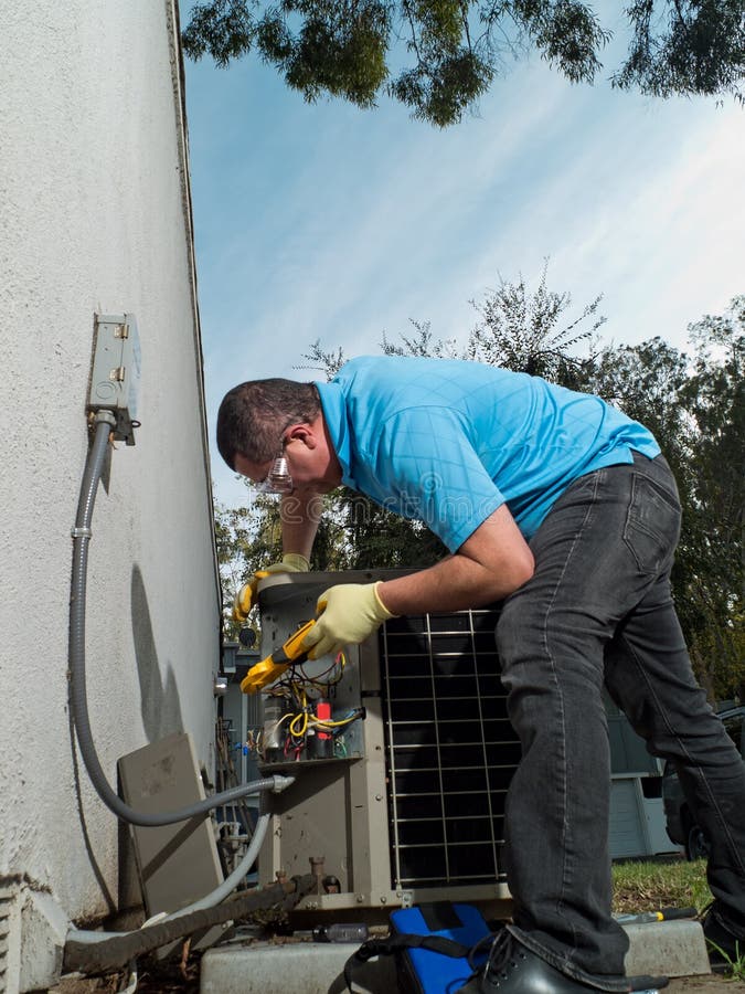 Man fixing air conditioner stock photo. Image of hands - 28623748