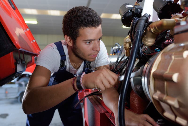 Man Fixing Automotive Engine Stock Photo - Image of profession, repair ...