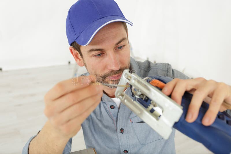 Man Fixing Blade in Electric Jigsaw Tool Stock Photo - Image of ...