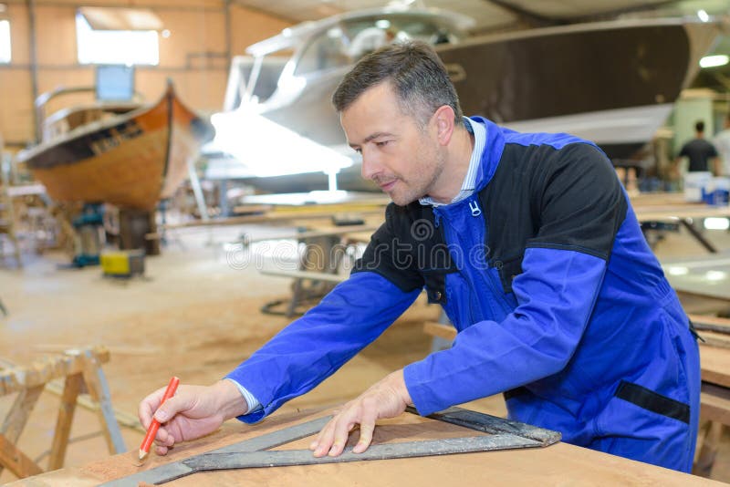 Man fixing boat stock image. Image of wood, measurment - 164147535