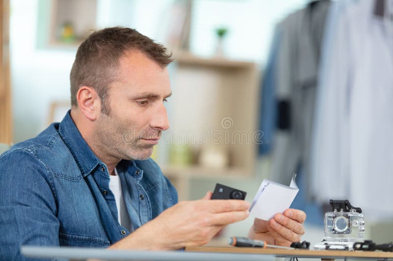 Man fixing camera stock image. Image of work, photograph - 270839807