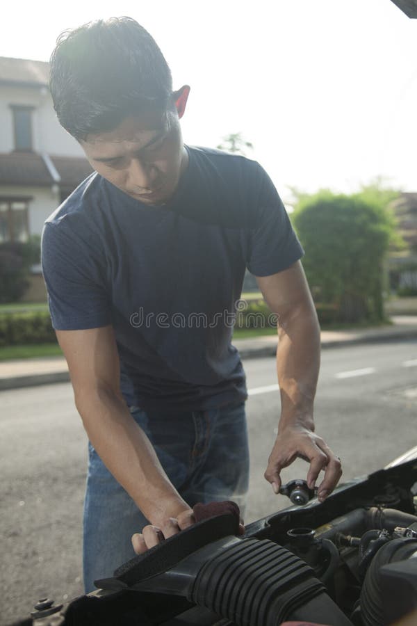 Man fixing a car stock image. Image of checking, vehicle - 183292633