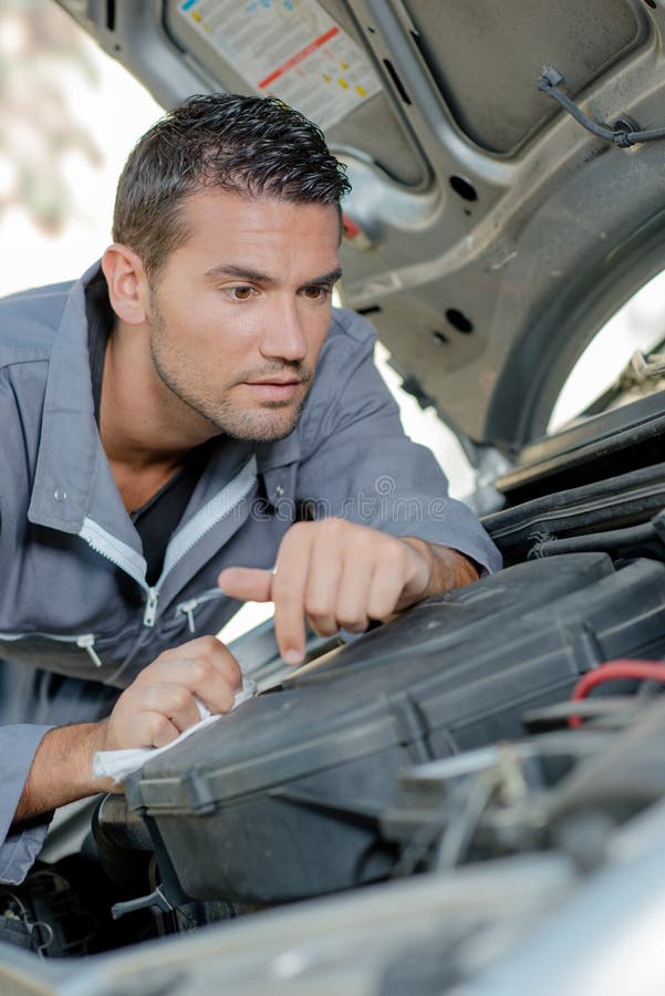 Man fixing car engine stock photo. Image of fixing, maintenance - 89315526