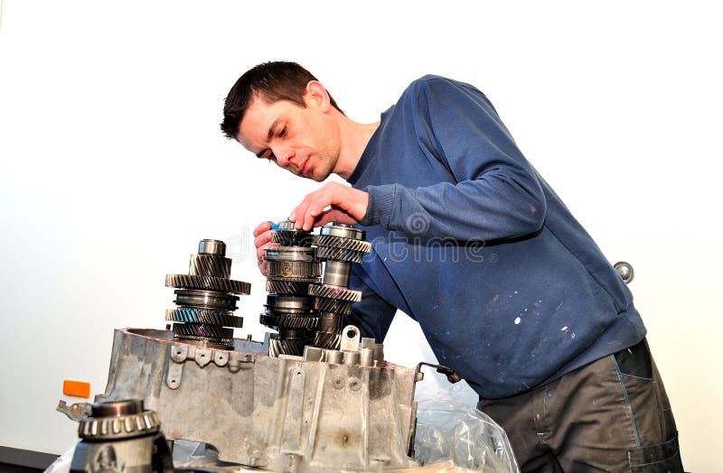 Composite Image of Confused Mechanic Repairing Car Engine Stock Image ...