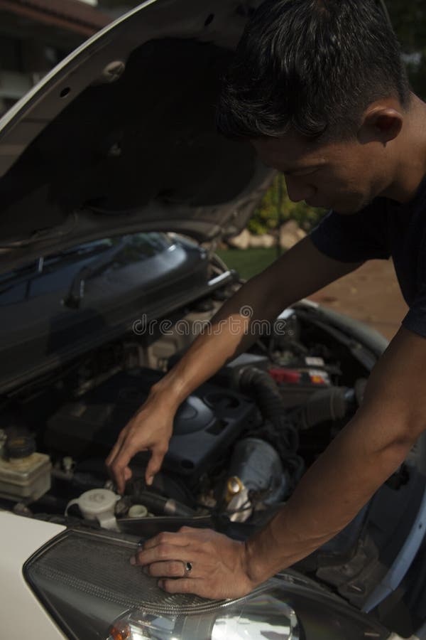 Man fixing a car stock photo. Image of parts, traveling - 183292262