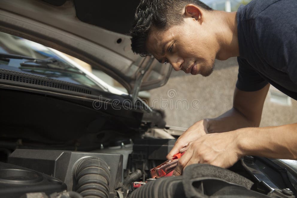 Man fixing a car stock image. Image of outdoor, mechanic - 183292387