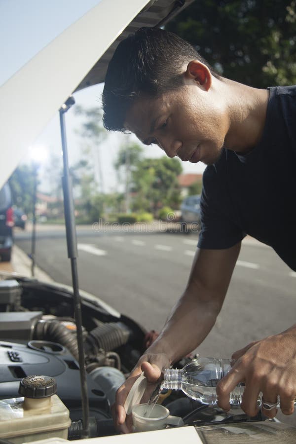 Man fixing a car stock photo. Image of outdoors, engine - 183292432
