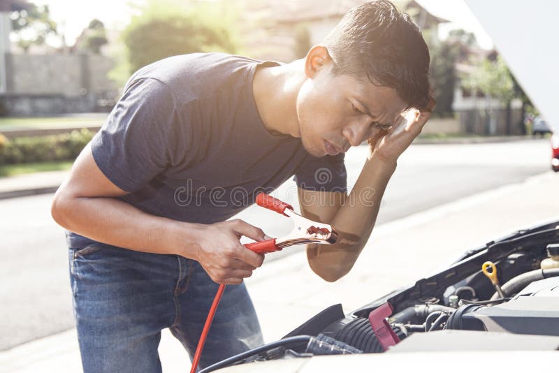 Man fixing a car stock photo. Image of outdoors, engine - 183292716