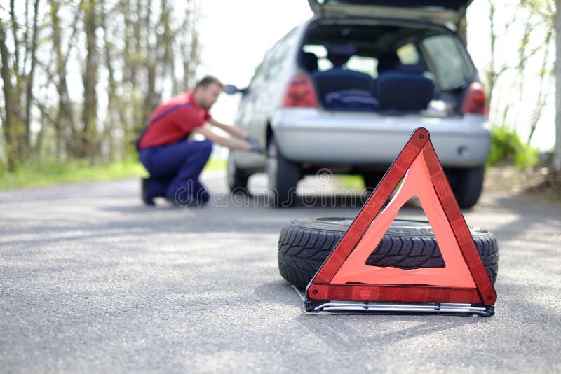 Man Fixing a Car Problem after Vehicle Breakdown on the Road Stock ...