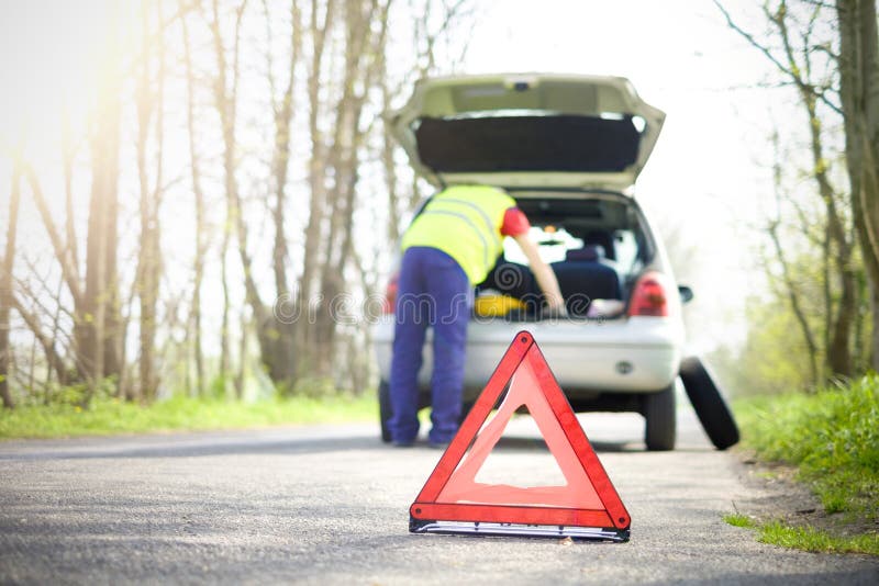 Man Fixing a Car Problem after Vehicle Breakdown on the Road Stock ...