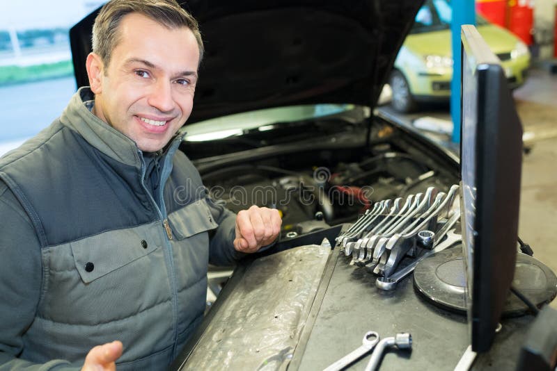 Man fixing car on street stock photo. Image of driving - 243807142