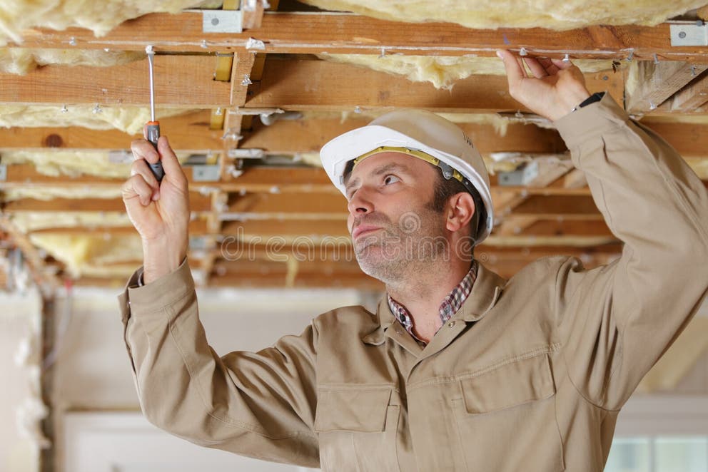 Man fixing ceiling stock image. Image of interior, lamp - 165452689