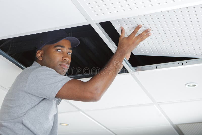 Man fixing ceiling stock photo. Image of office, repari - 281912816