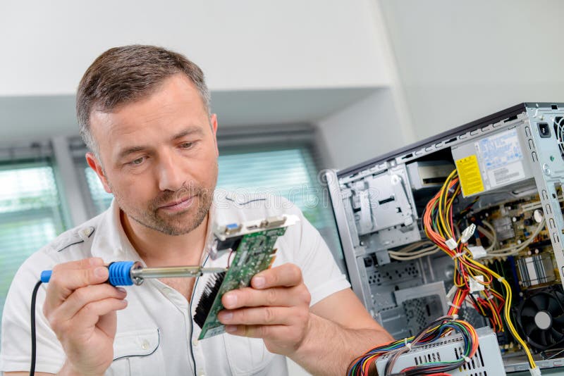 Man fixing computer stock image. Image of memory, assistance - 250314875