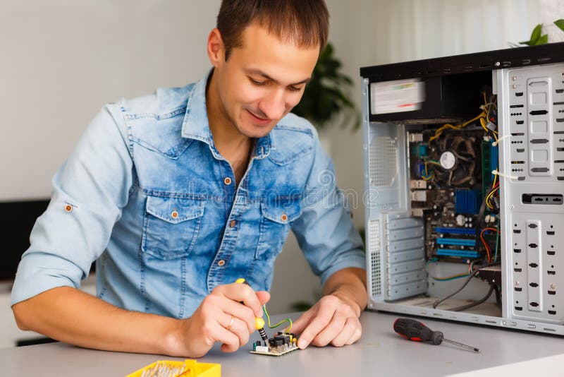 Man fixing a computer stock image. Image of maintenance - 187712985