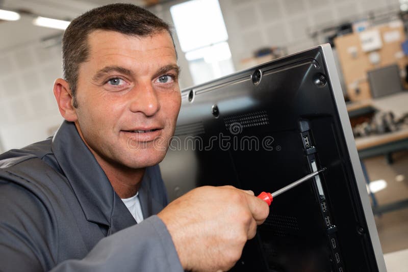 Man fixing computer screen stock image. Image of tight - 310487589