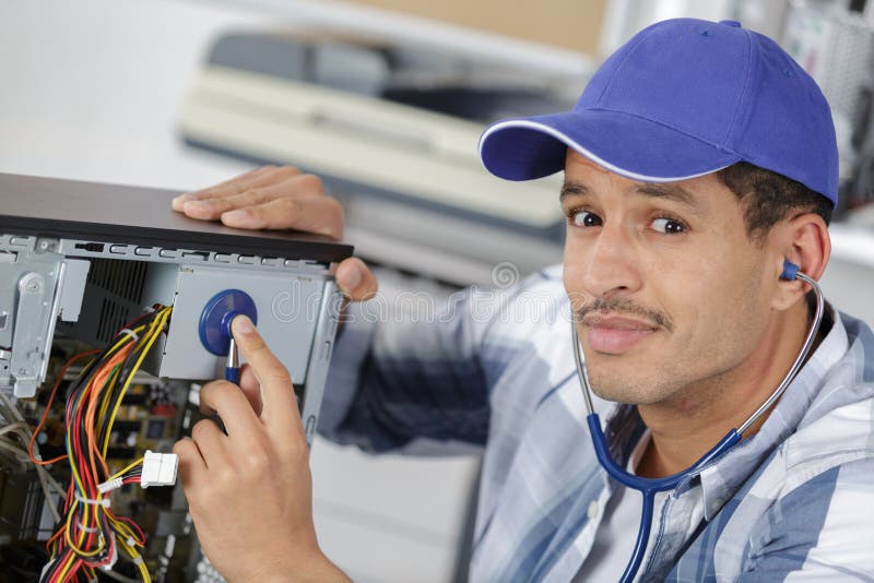 Man Fixing Computer with Stetheoscope Stock Photo - Image of help, male ...