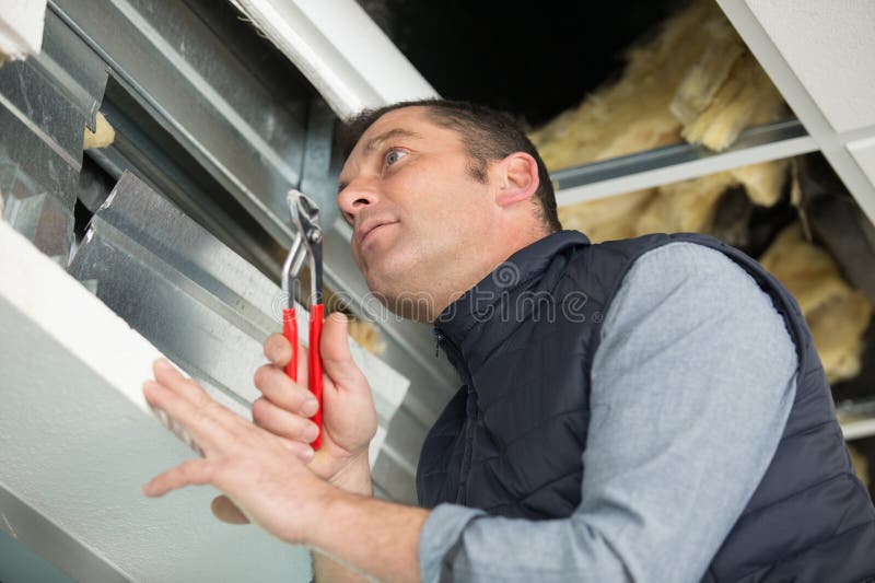 Man Fixing Device on Ceiling with Screwdriver Stock Image - Image of ...