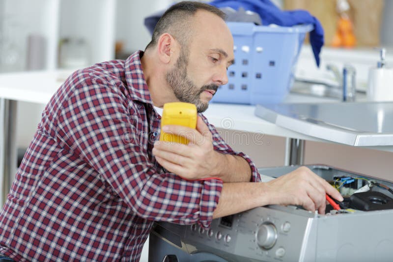 Man Fixing Domestic Washing Machine Stock Photo - Image of equipment ...