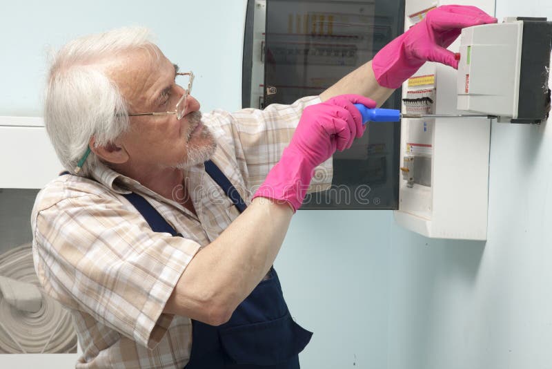 Man Fixing Electric Light Meter Stock Photo - Image of light ...