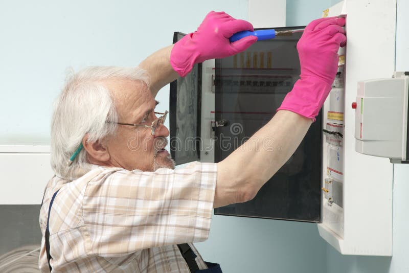 Man Fixing Electric Light Meter Stock Image - Image of industrial ...