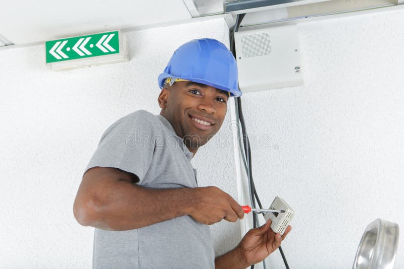 Man fixing electrical wire stock image. Image of install - 162092065