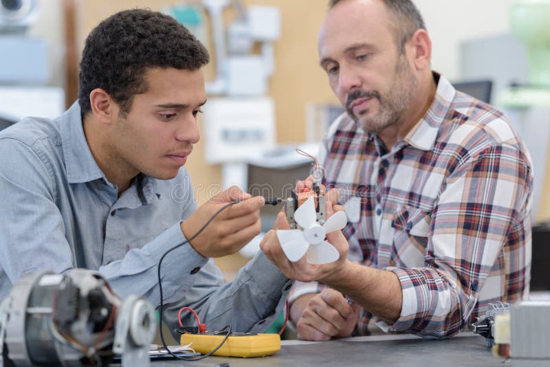 Man Fixing Electronic Circuits in Service Center Stock Image - Image of ...