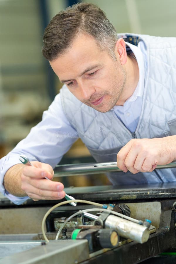 Man Fixing Electronics Factory Stock Photo - Image of color, engineer ...