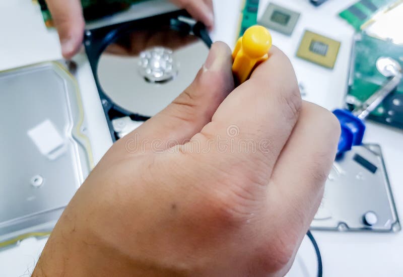 Man fixing electronics stock photo. Image of equipments - 129813410