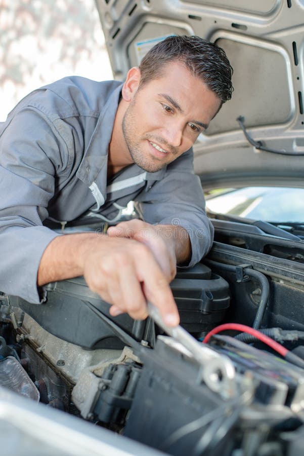 Man fixing engine stock image. Image of employment, repairman - 188231567