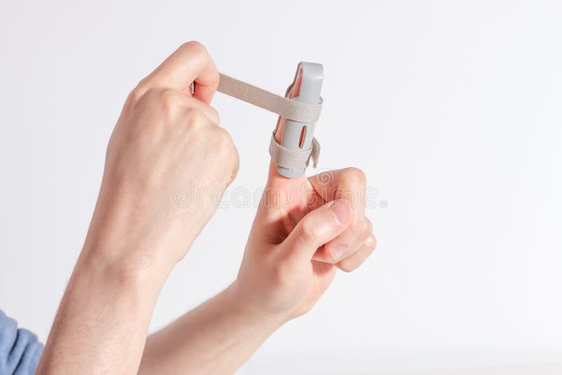 A Man Joining Velcro on a Plastic Splint Stock Photo - Image of hands ...