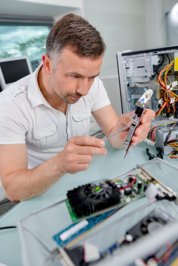 Man fixing hard drive stock photo. Image of screwdriver - 102666566