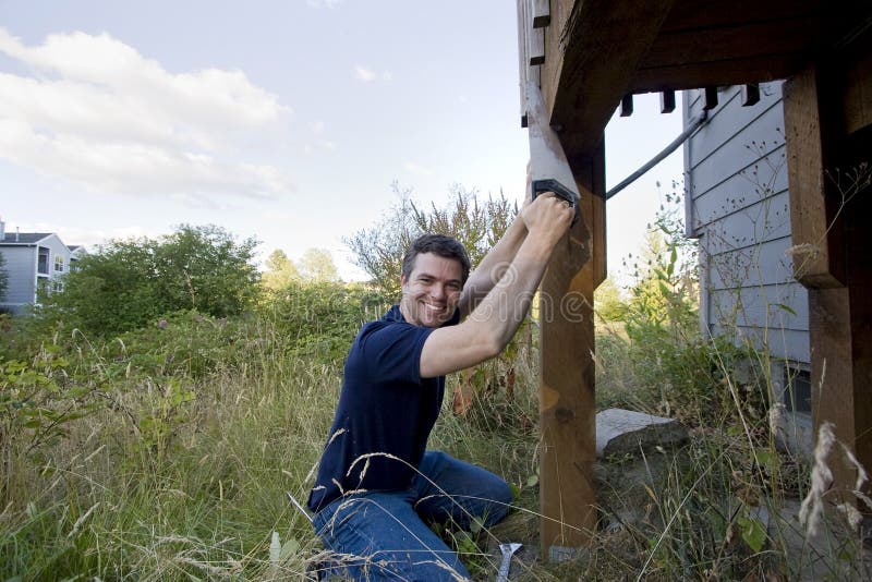 Man Fixing House stock image. Image of tired, male, outside - 6201965