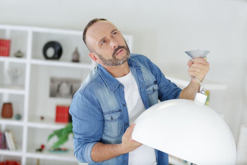 Man fixing lamps stock image. Image of craftsman, comic - 173518249