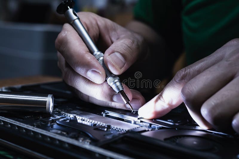 Man fixing laptop computer stock image. Image of examining - 232085861