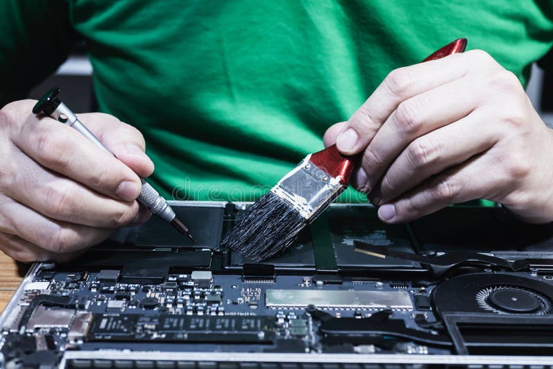 Man fixing laptop computer stock photo. Image of component - 232085850