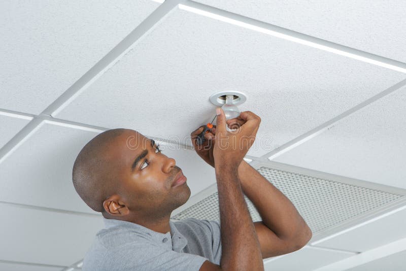 Man fixing light bulb stock image. Image of reparation - 248310021