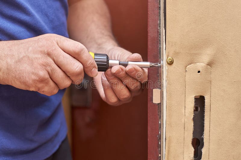 Man Fixing a Lock in Old Door Stock Photo - Image of handle, contractor ...