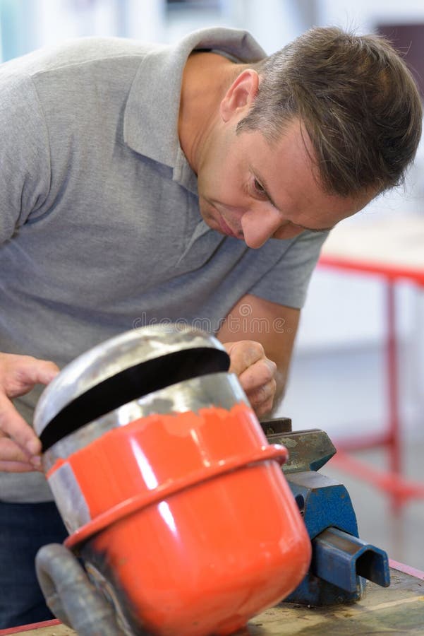 A Man is Fixing Machine in Automotive Service Center Stock Image ...