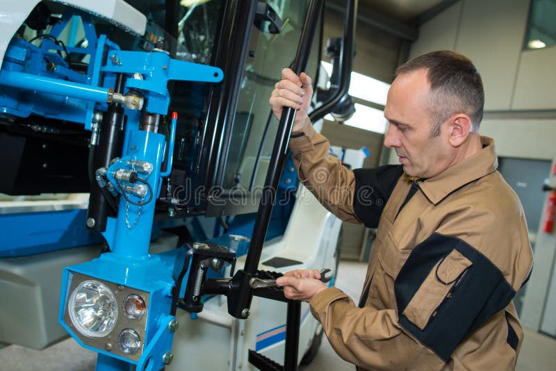 Man fixing a machine stock image. Image of duty, caucasian - 186138473