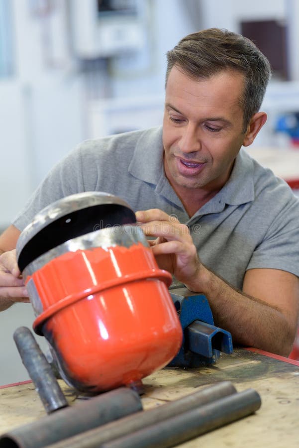 Man fixing machine stock photo. Image of caucasian, shop - 250117032