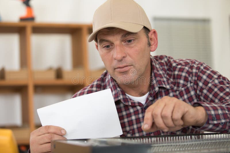 Man fixing machine stock photo. Image of industrial - 319213766