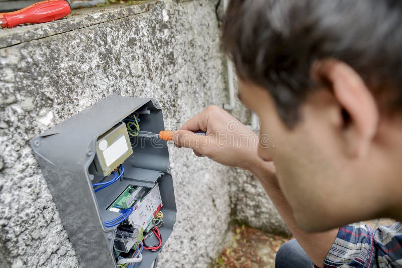 Man fixing meter stock photo. Image of trade, repairing - 269560108