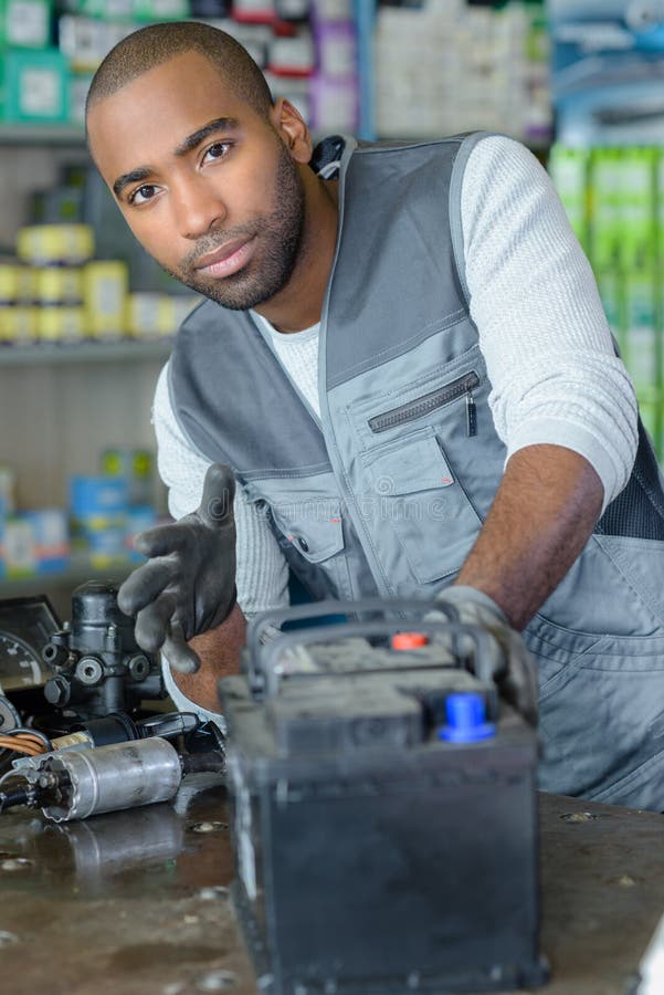 Man fixing motor stock photo. Image of knowledge, industrial - 188228848