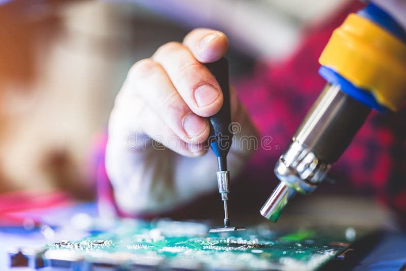 Man fixing a PC hardware stock image. Image of hands - 144472235